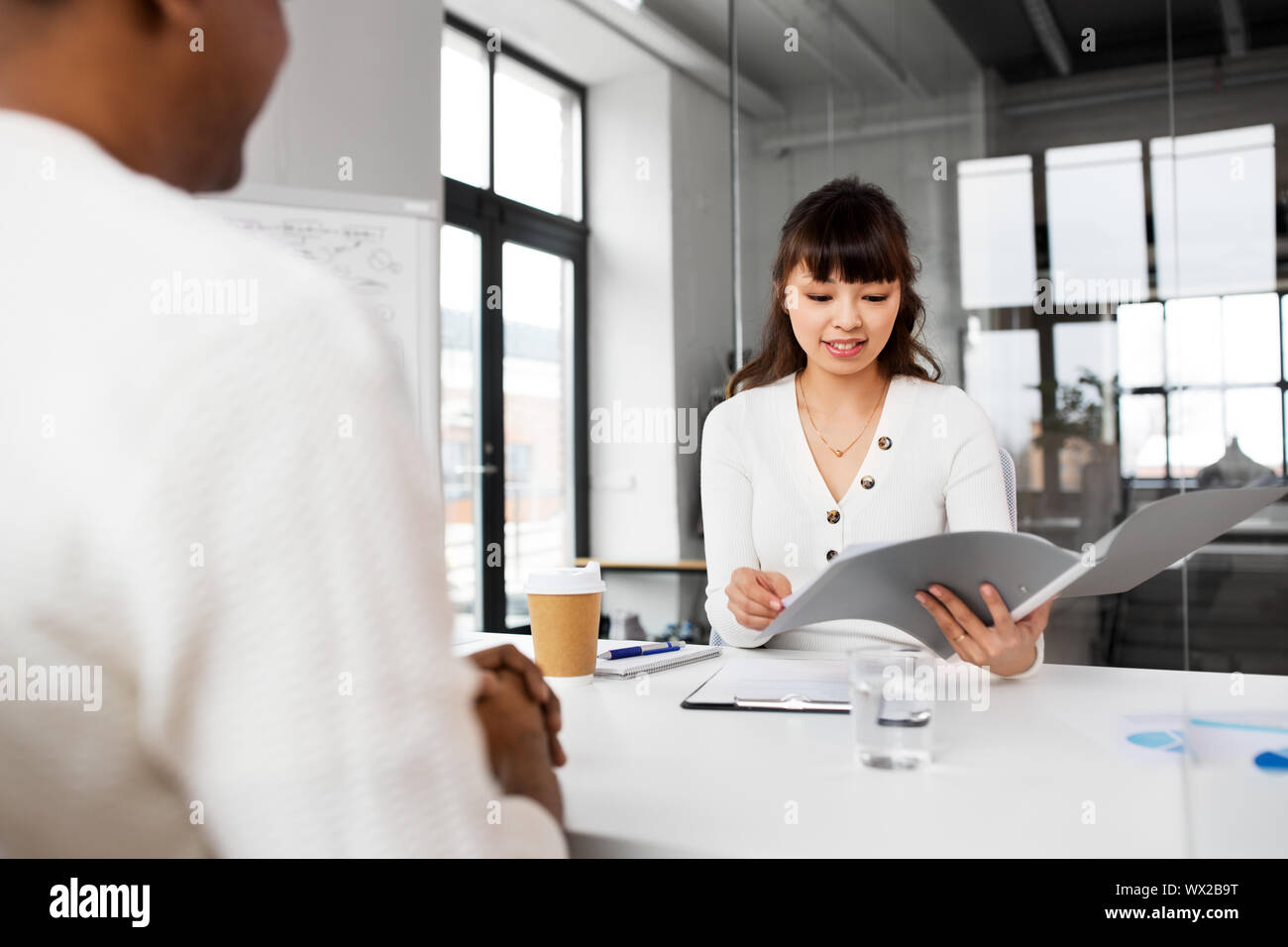 employer having interview with employee at office Stock Photo - Alamy