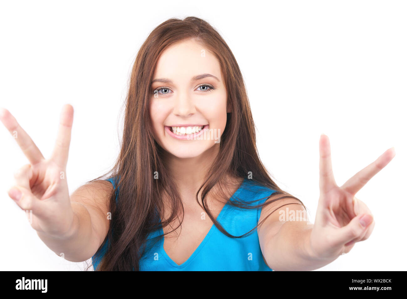 bright picture of lovely girl showing victory sign Stock Photo - Alamy