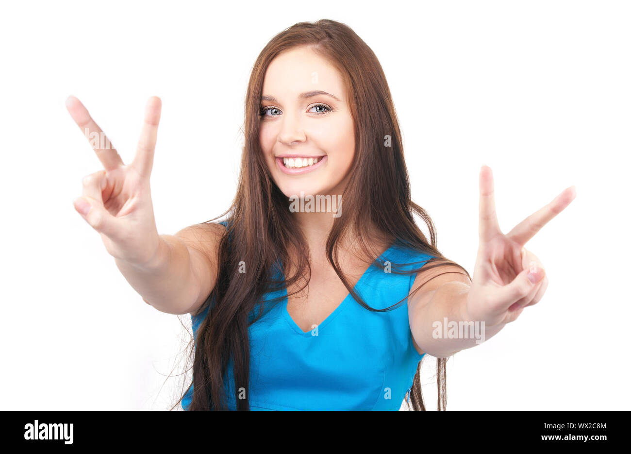bright picture of lovely girl showing victory sign Stock Photo - Alamy