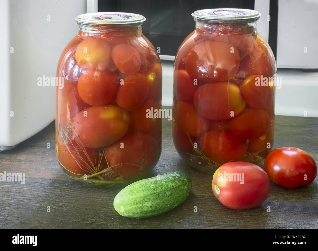 Canned ripe tomatoes in large glass jars Stock Photo - Alamy