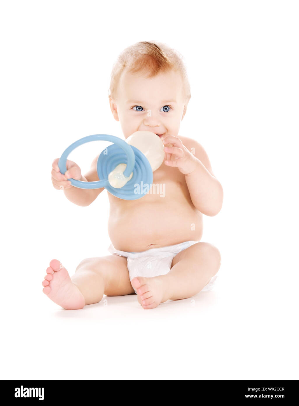 picture of baby boy with big pacifier over white Stock Photo - Alamy