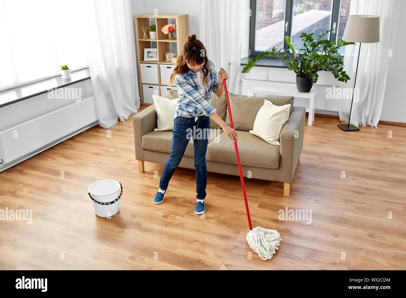 woman or housewife with mop cleaning floor at home Stock Photo - Alamy