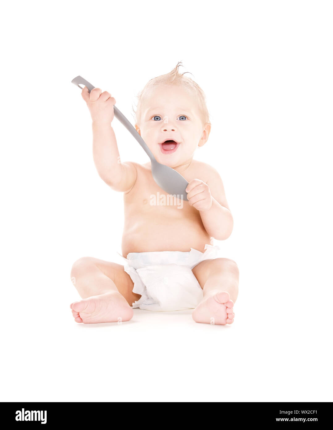baby boy with big spoon Stock Photo - Alamy