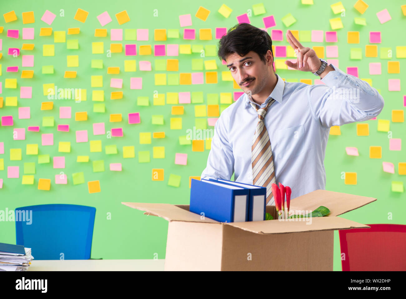 Man collecting his stuff after redundancy in the office with man Stock ...