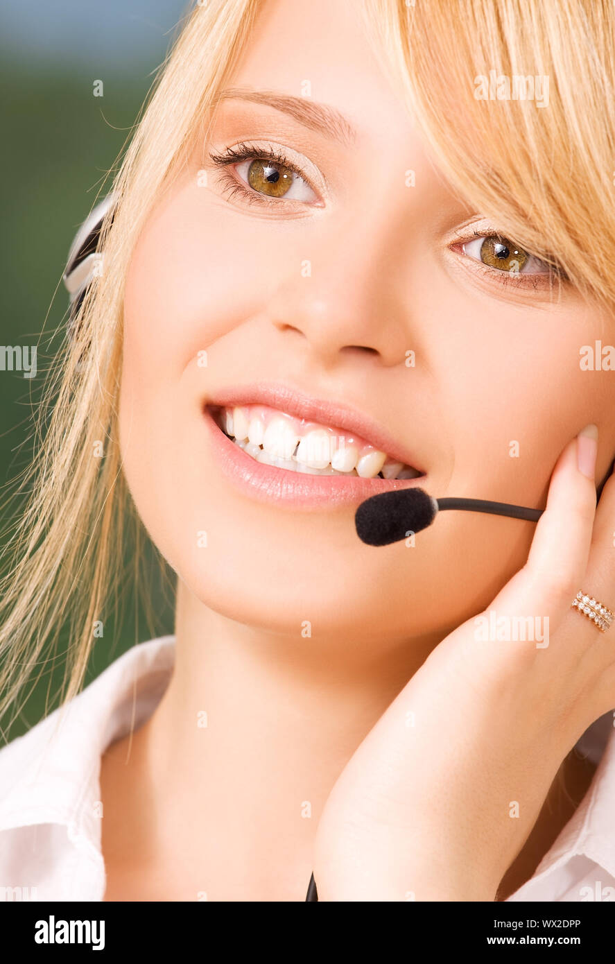 bright picture of friendly female helpline operator Stock Photo - Alamy