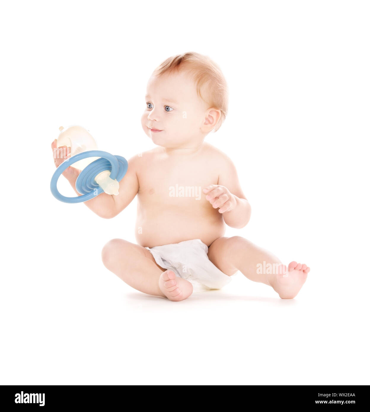 picture of baby boy with big pacifier over white Stock Photo - Alamy