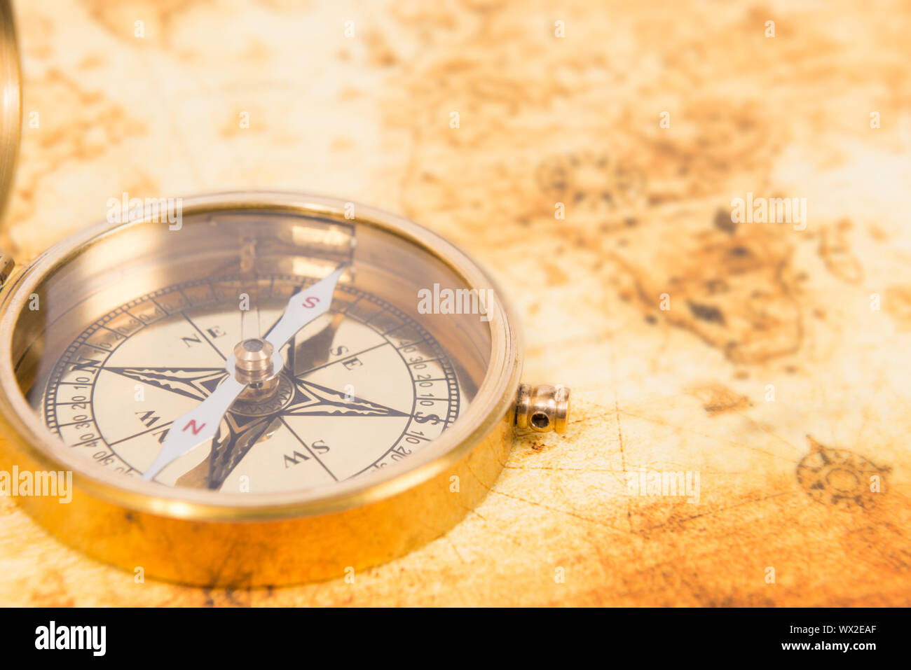 Old map with an ancient compass Stock Photo - Alamy