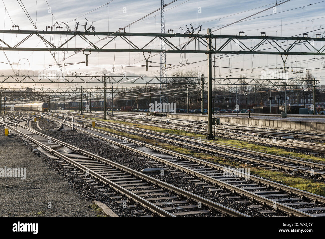 Railway tracks in morning sun at the Dutch station of The Hague Stock ...