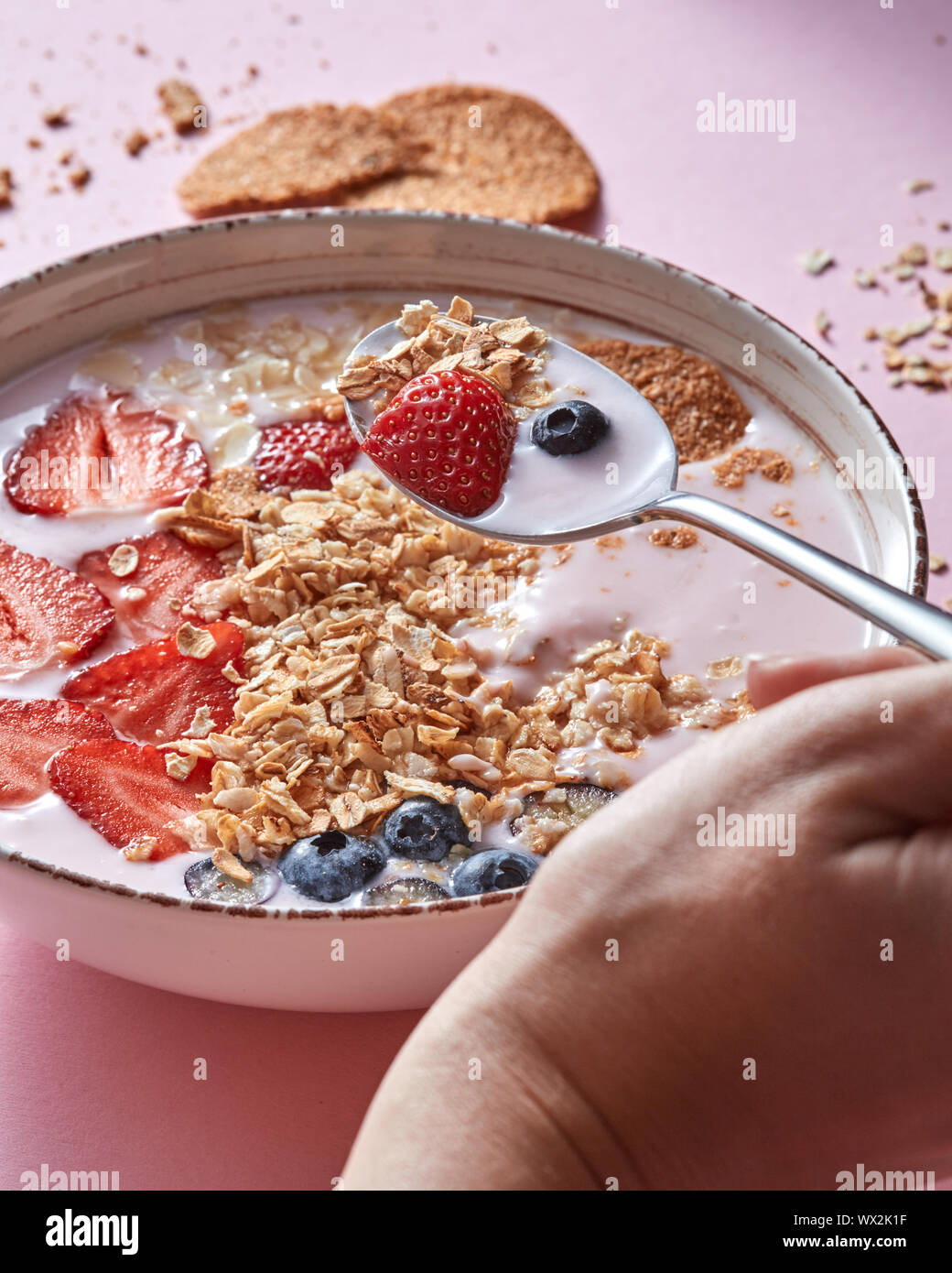 Female hand takes blueberry hi-res stock photography and images - Alamy