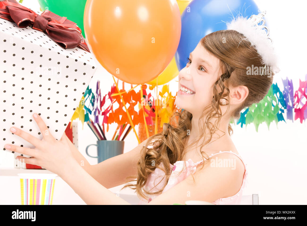 party girl with balloons and gift box Stock Photo - Alamy