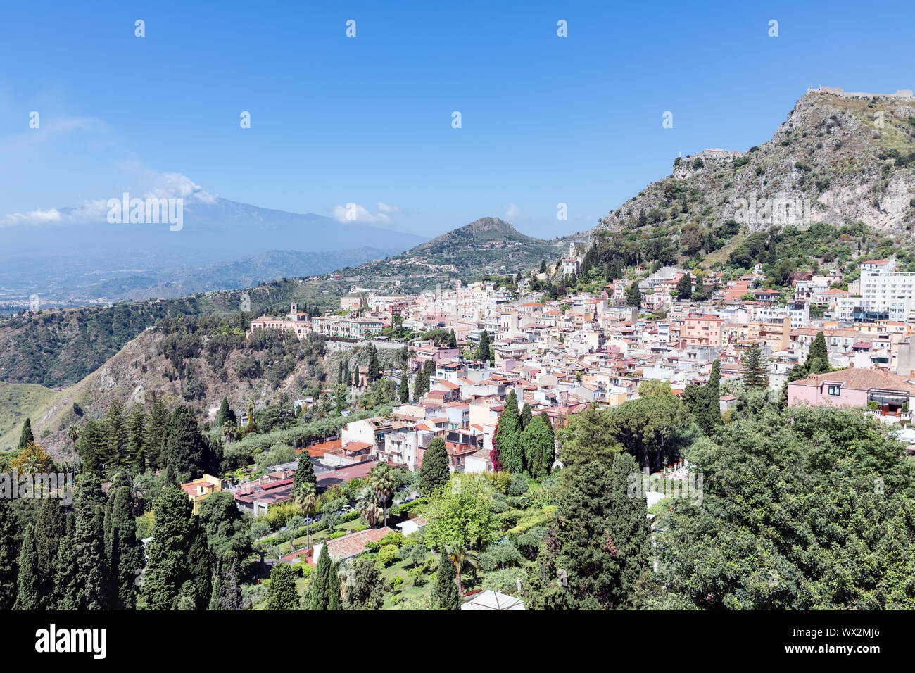 Panorama Taormina with southward view smoking Etna volcano, Sicily ...