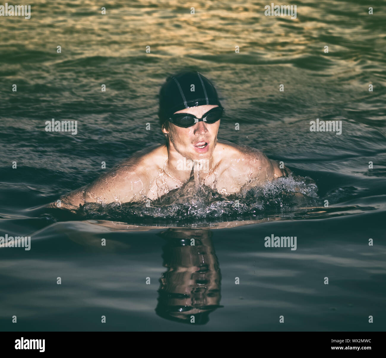 Swimmer breathing during swimming crawl Stock Photo - Alamy