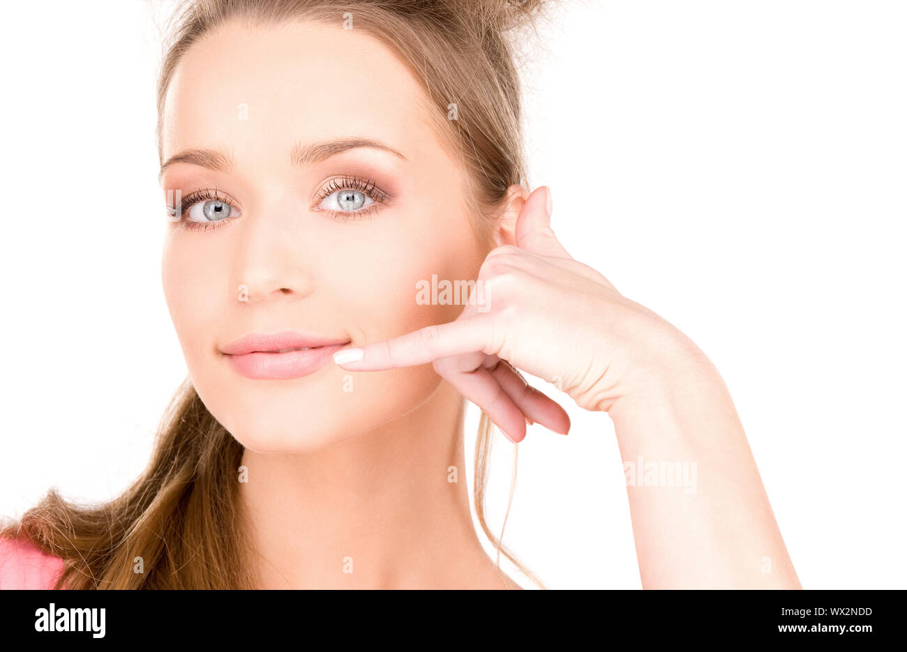 picture of lovely woman making a call me gesture Stock Photo - Alamy