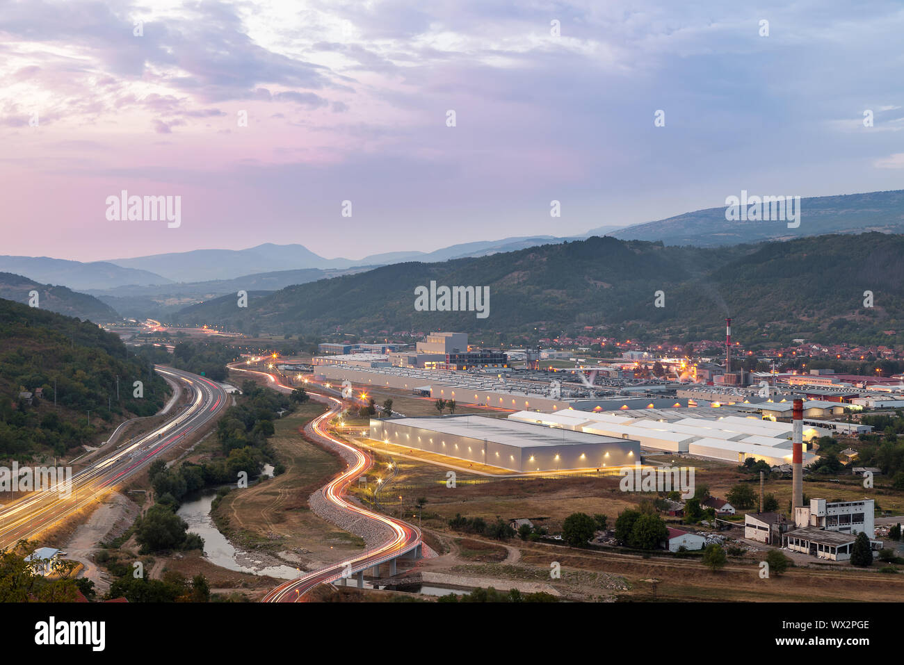 View from above of a large, modern, lighten factory, old, ruined ...