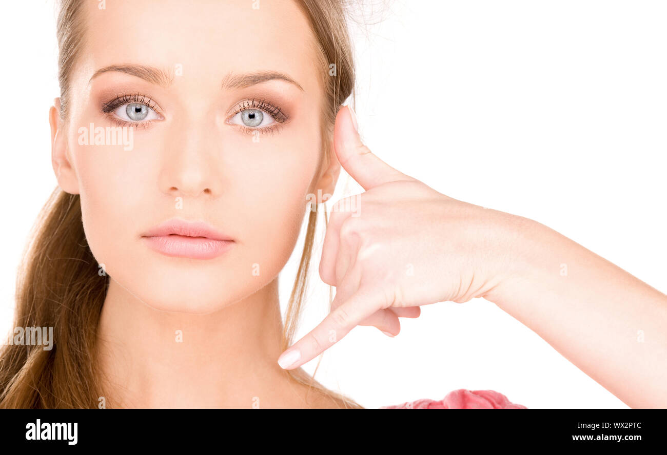 picture of lovely woman making a call me gesture Stock Photo - Alamy