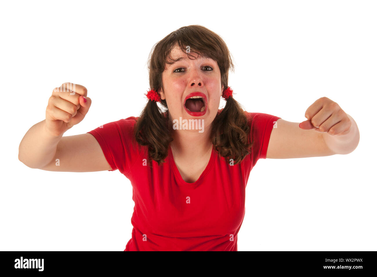 Portrait of an angry young teen girl in red Stock Photo - Alamy