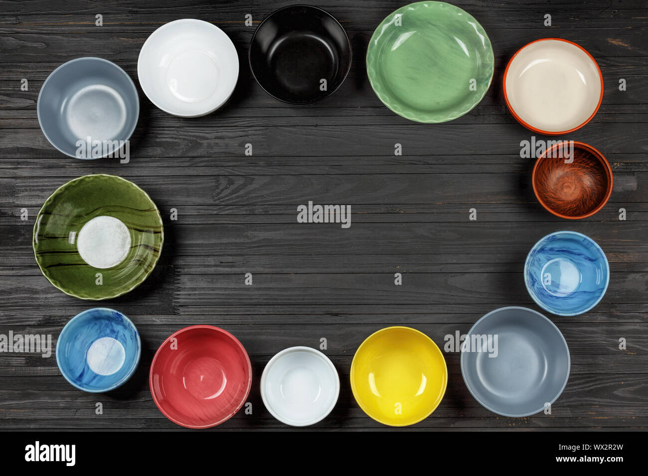 food, cooking, Multicolored bowls, utensils, concept, black table Stock ...