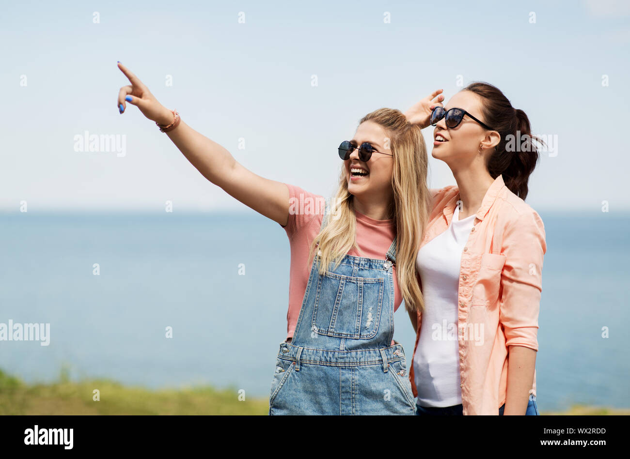 teenage girls or best friends at seaside in summer Stock Photo - Alamy