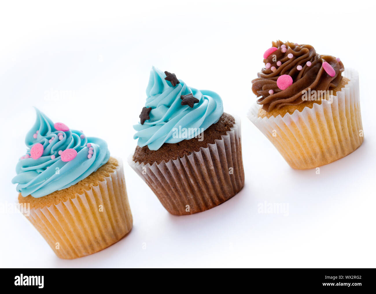 Three cupcakes in a row Stock Photo - Alamy