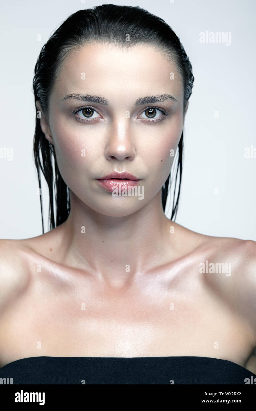 Beauty portrait of female with shiny glitter skin. Woman with natural ...