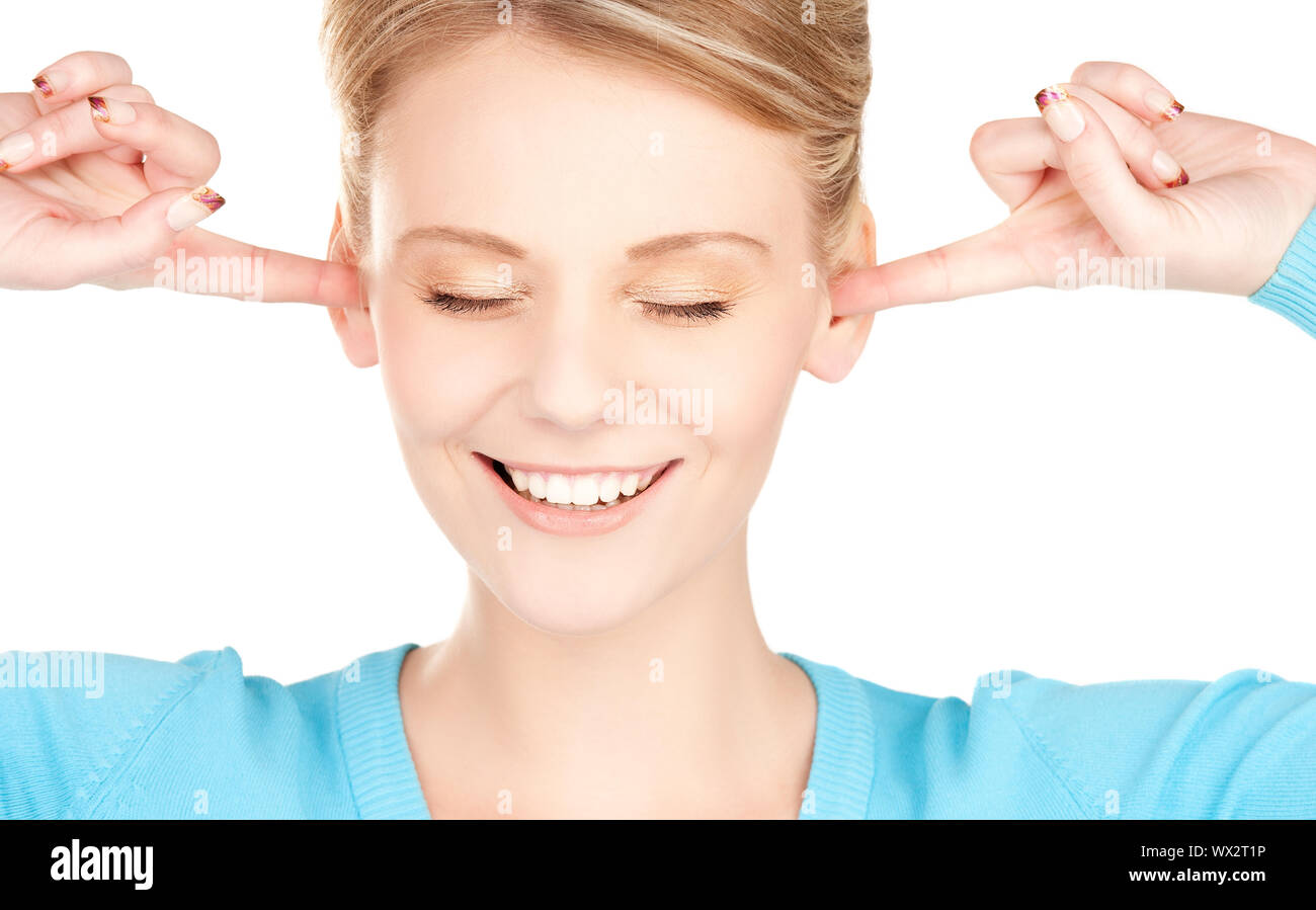 picture of smiling woman with hands over ears Stock Photo - Alamy
