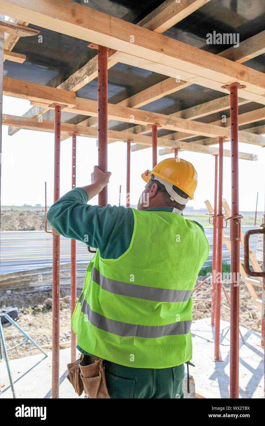 Construction worker on building site Stock Photo - Alamy