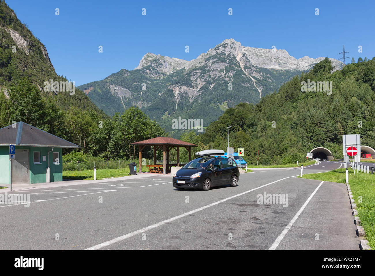 Austrian highway with cars leaving a tunnel through a mountain Stock ...