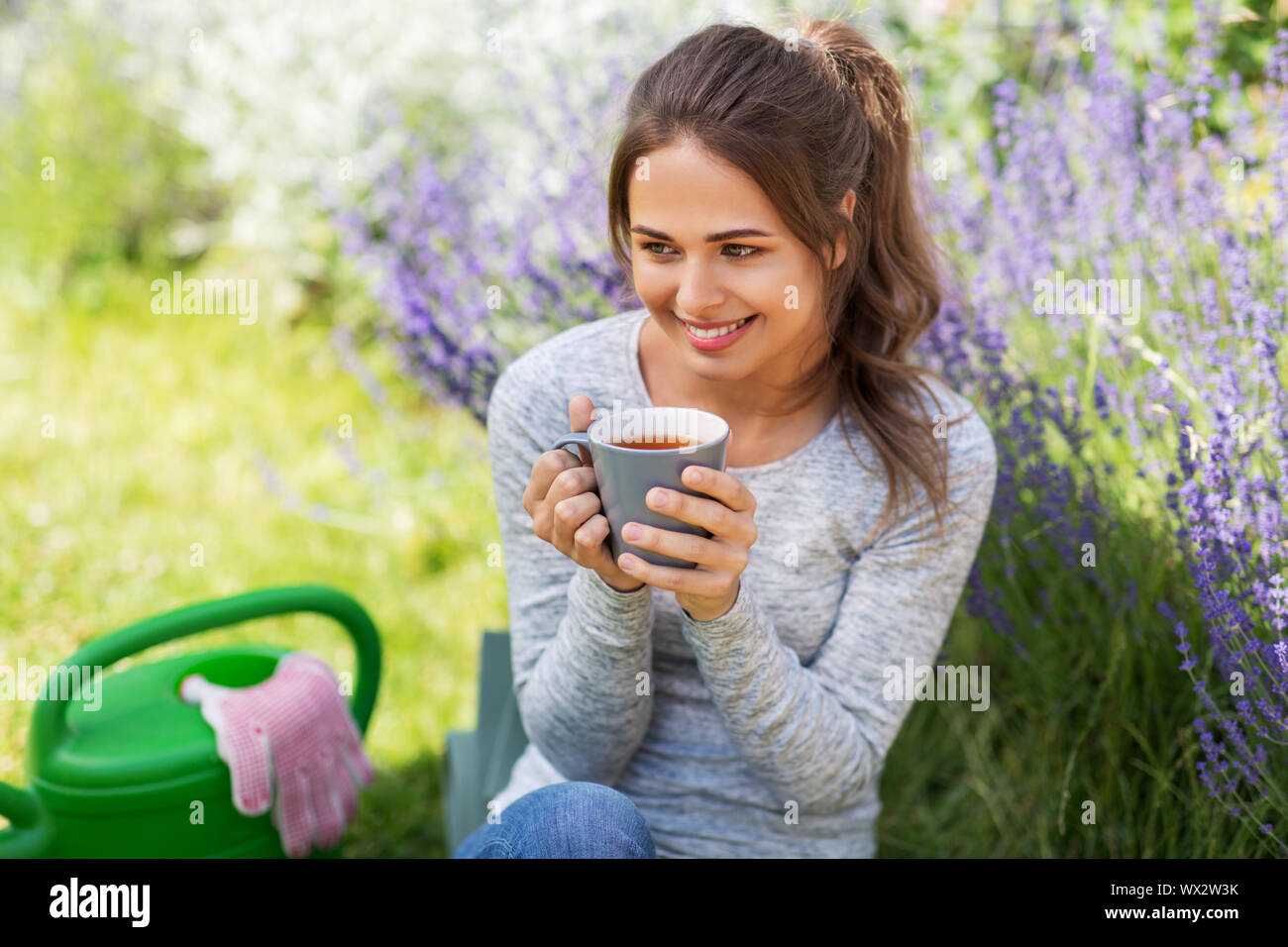 Woman drinking tea summer hi-res stock photography and images - Alamy