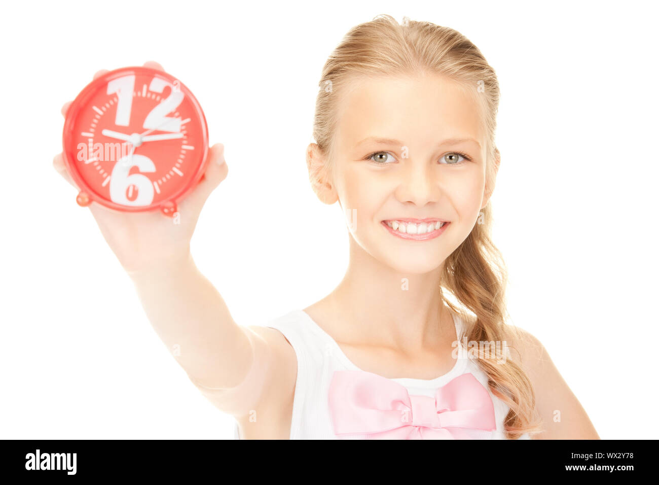 girl holding alarm clock Stock Photo - Alamy