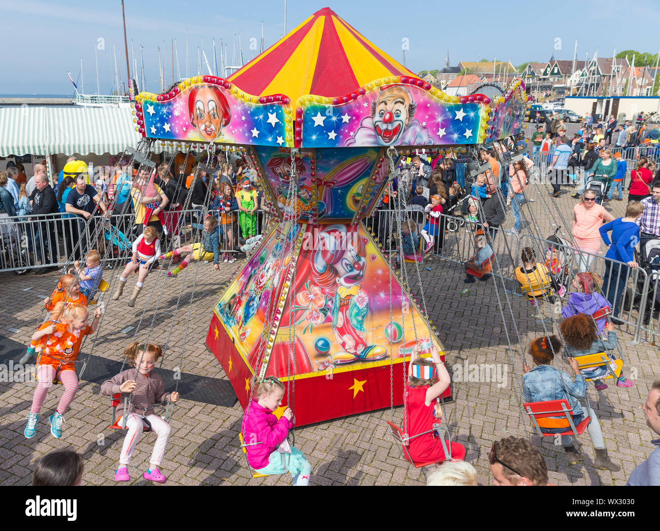 Children have fun in a carousel at a Dutch national holiday Stock Photo ...