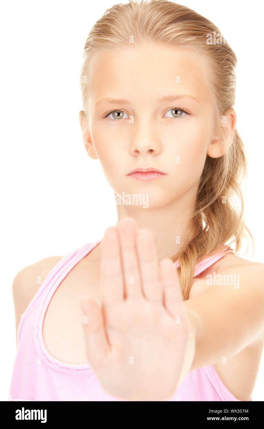 bright picture of lovely girl showing stop sign Stock Photo - Alamy