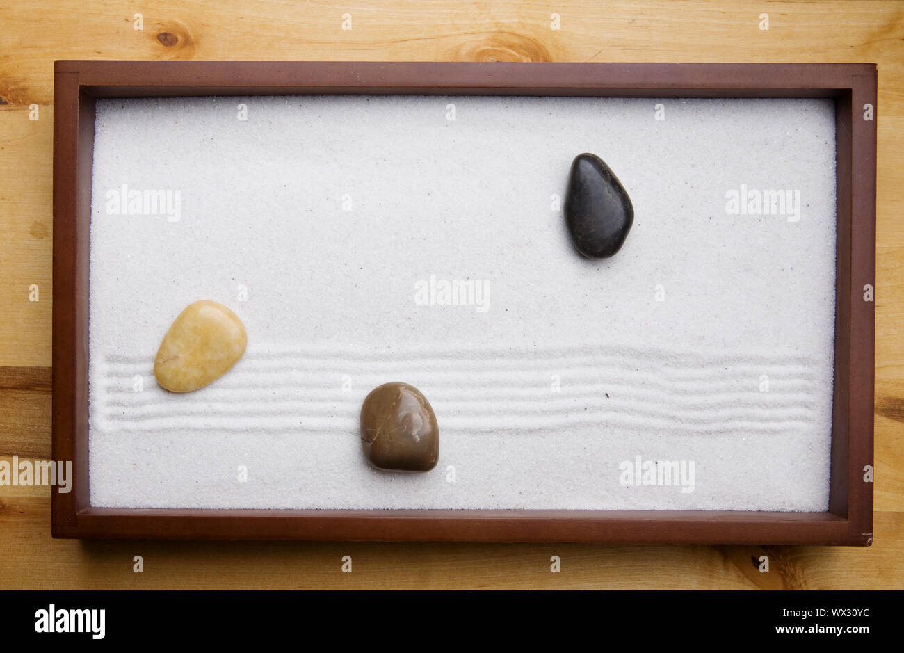 Miniature Zen rock garden background Stock Photo - Alamy