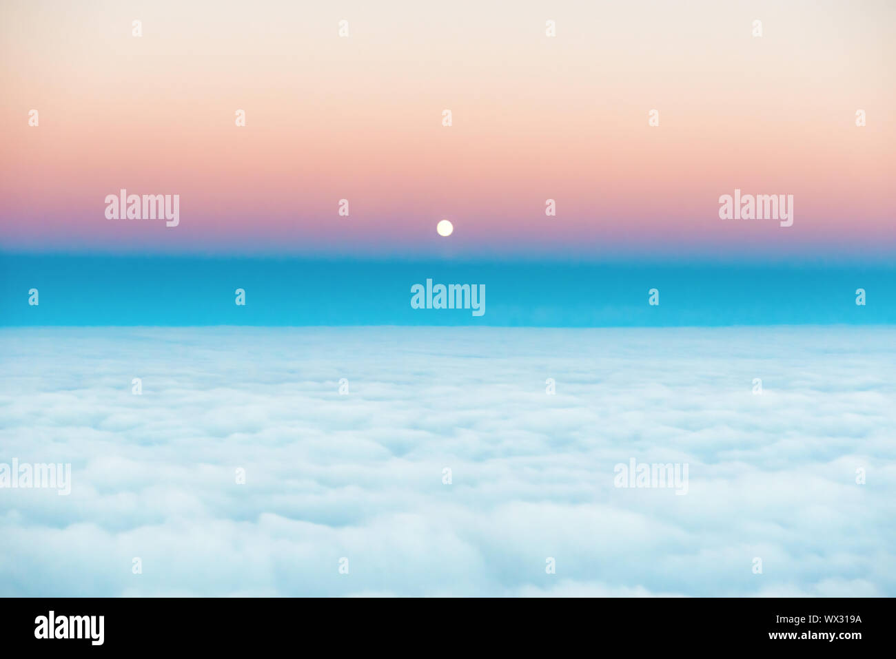 Sky and clouds at sunset with full moon rising Stock Photo - Alamy