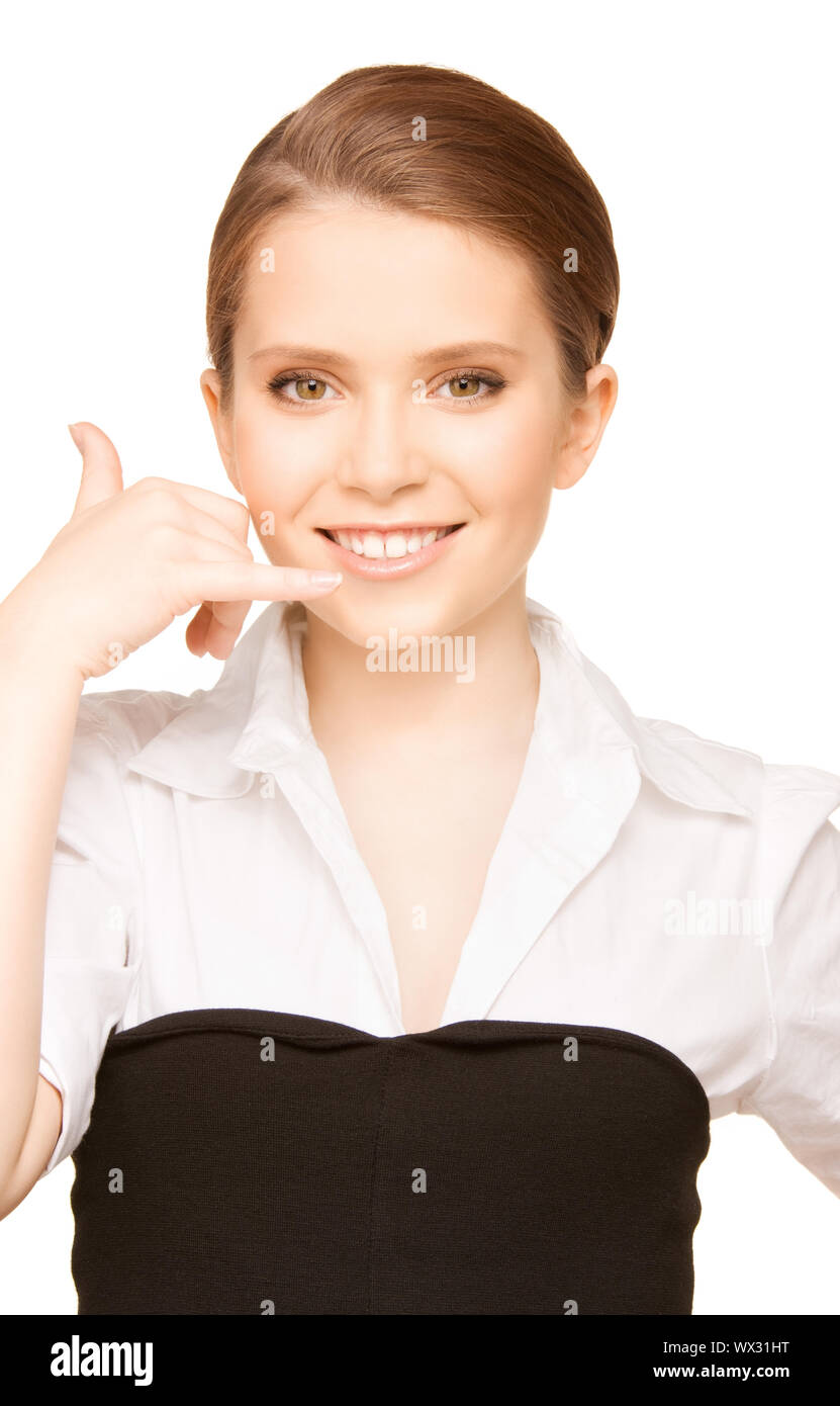 picture of lovely woman making a call me gesture Stock Photo - Alamy