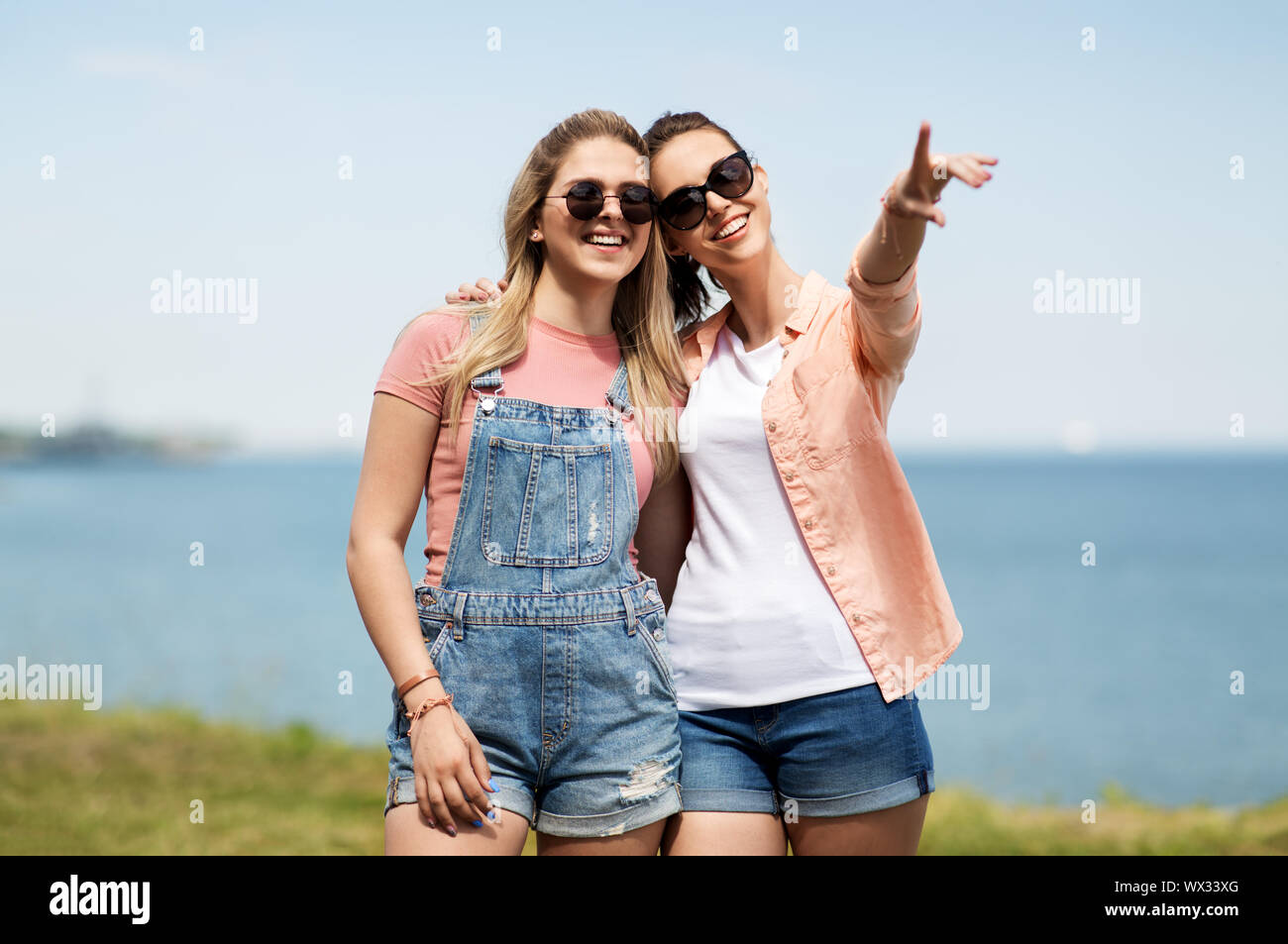 teenage girls or best friends at seaside in summer Stock Photo - Alamy