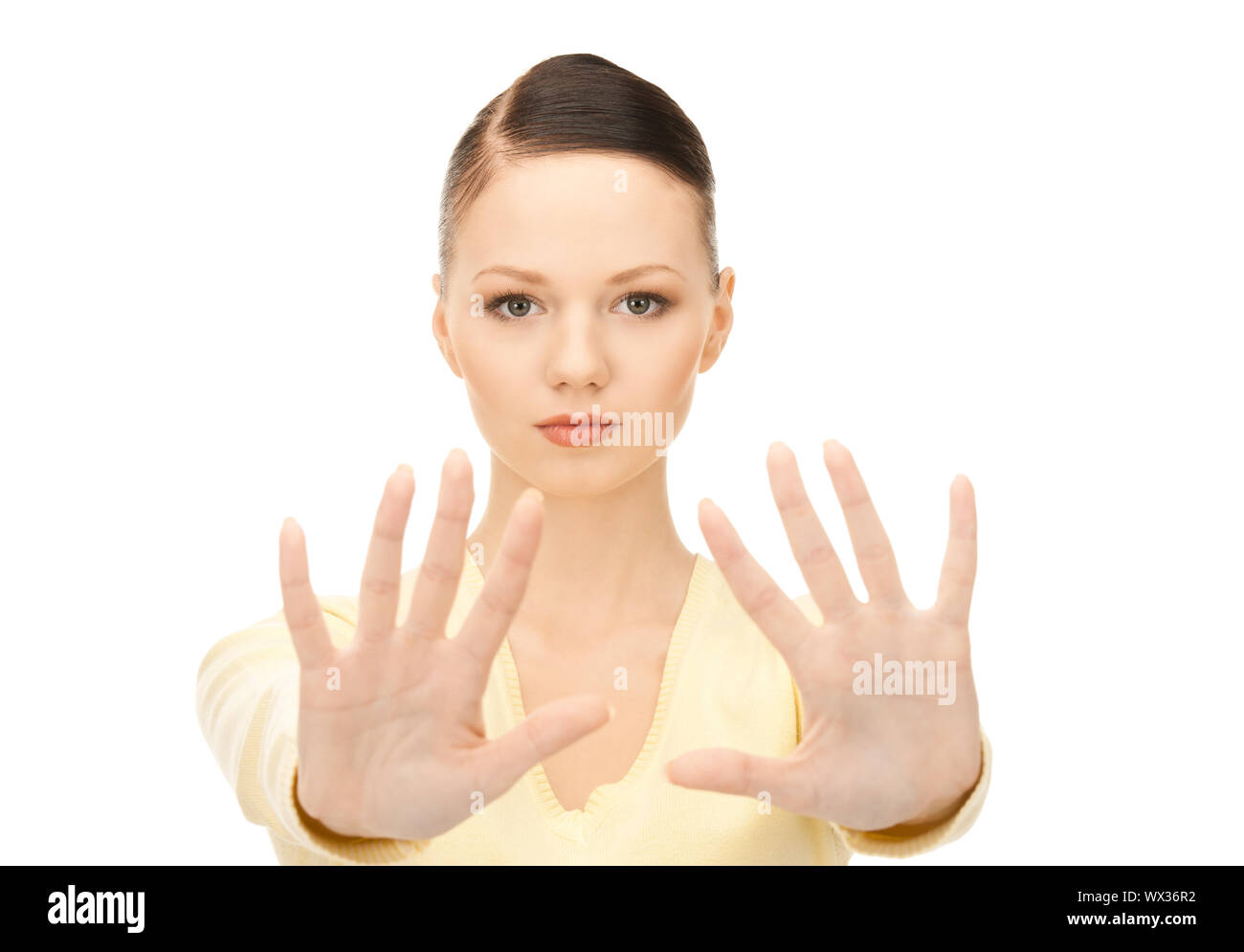 bright picture of young woman making stop gesture Stock Photo - Alamy