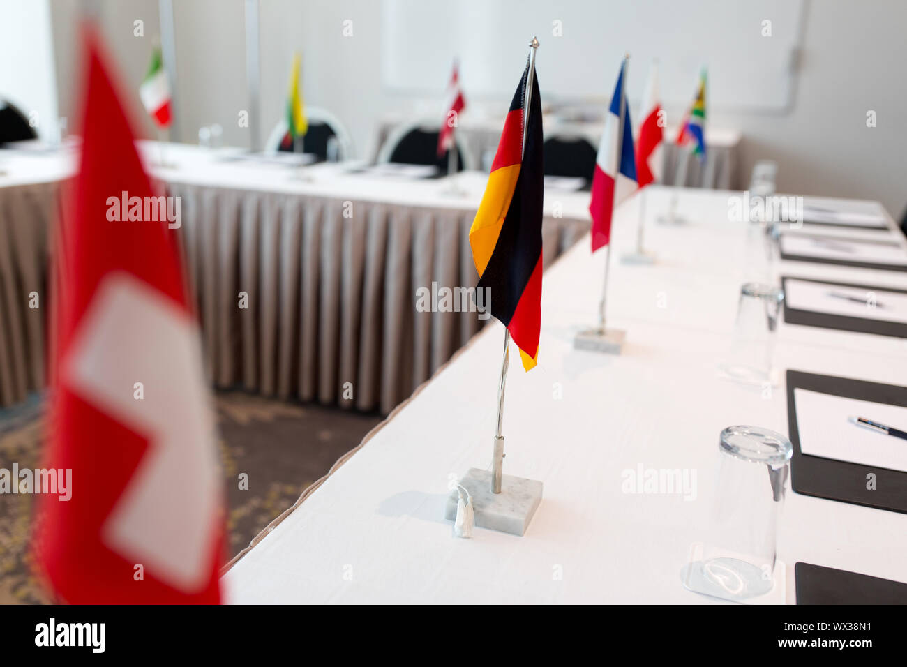 Table flags conference hi-res stock photography and images - Alamy