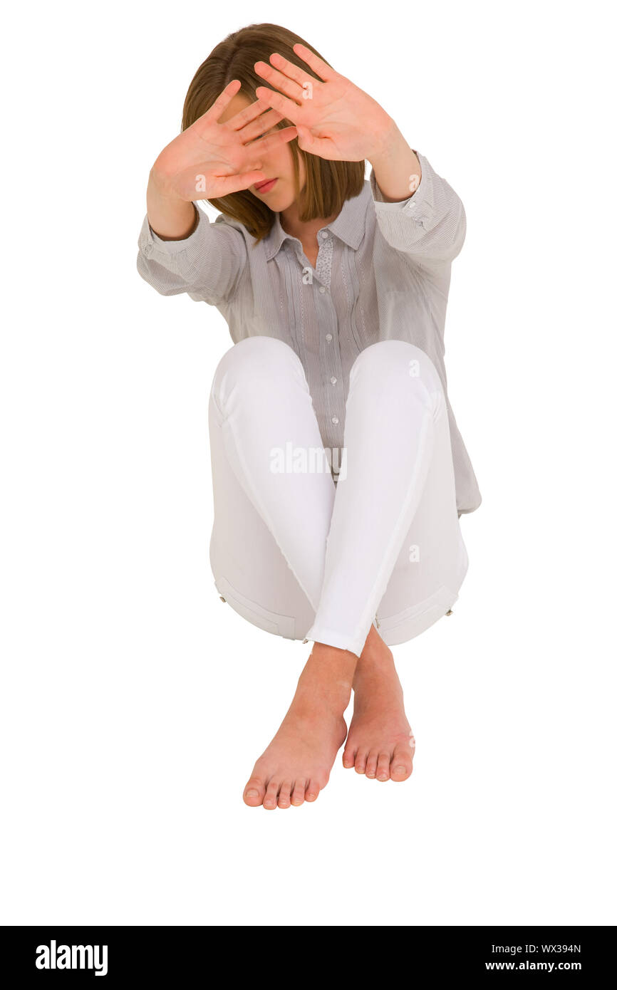 teenage girl holding hand up to block violence Stock Photo - Alamy