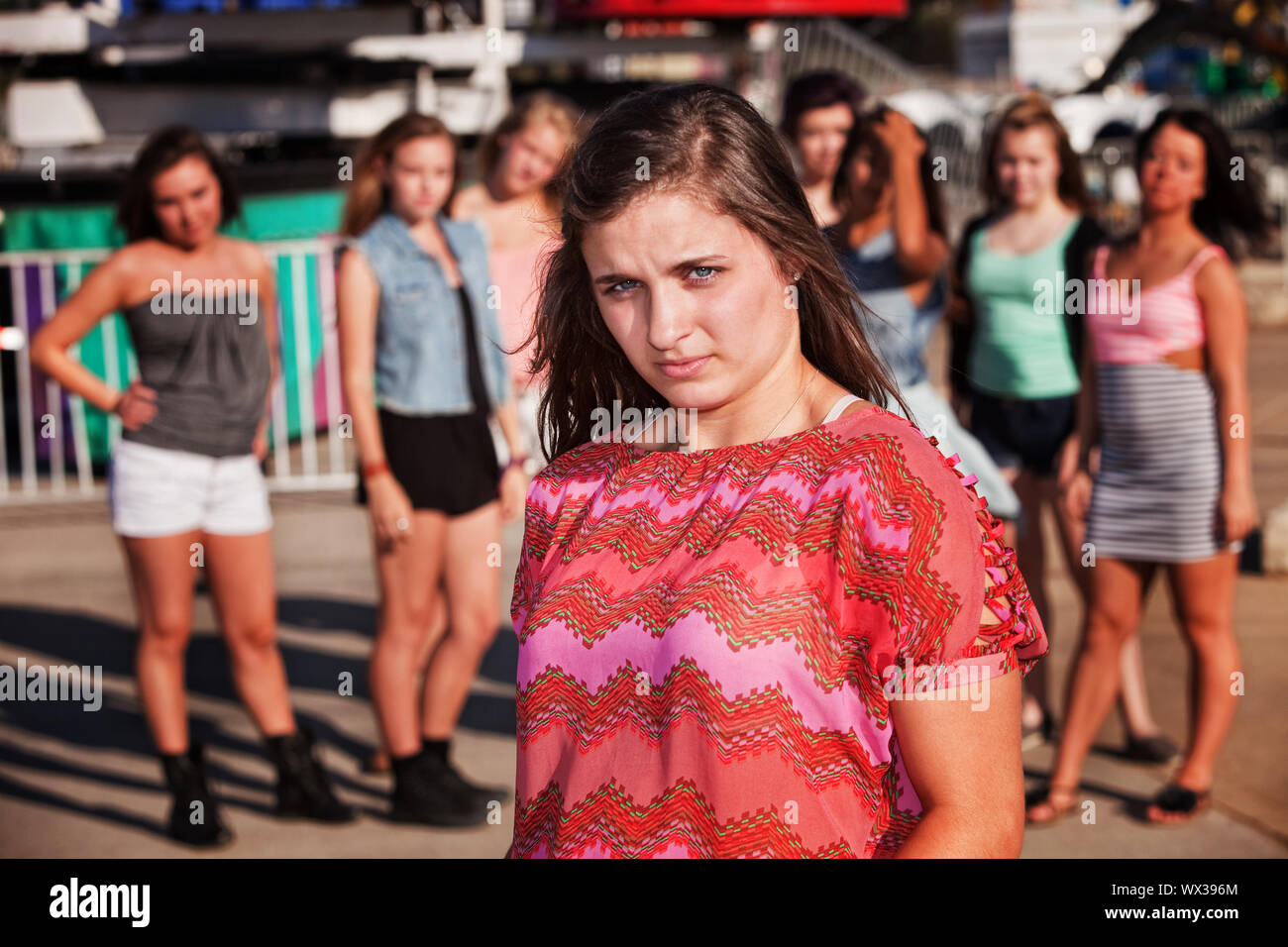 Skeptical European teenager at carnival with friends Stock Photo - Alamy
