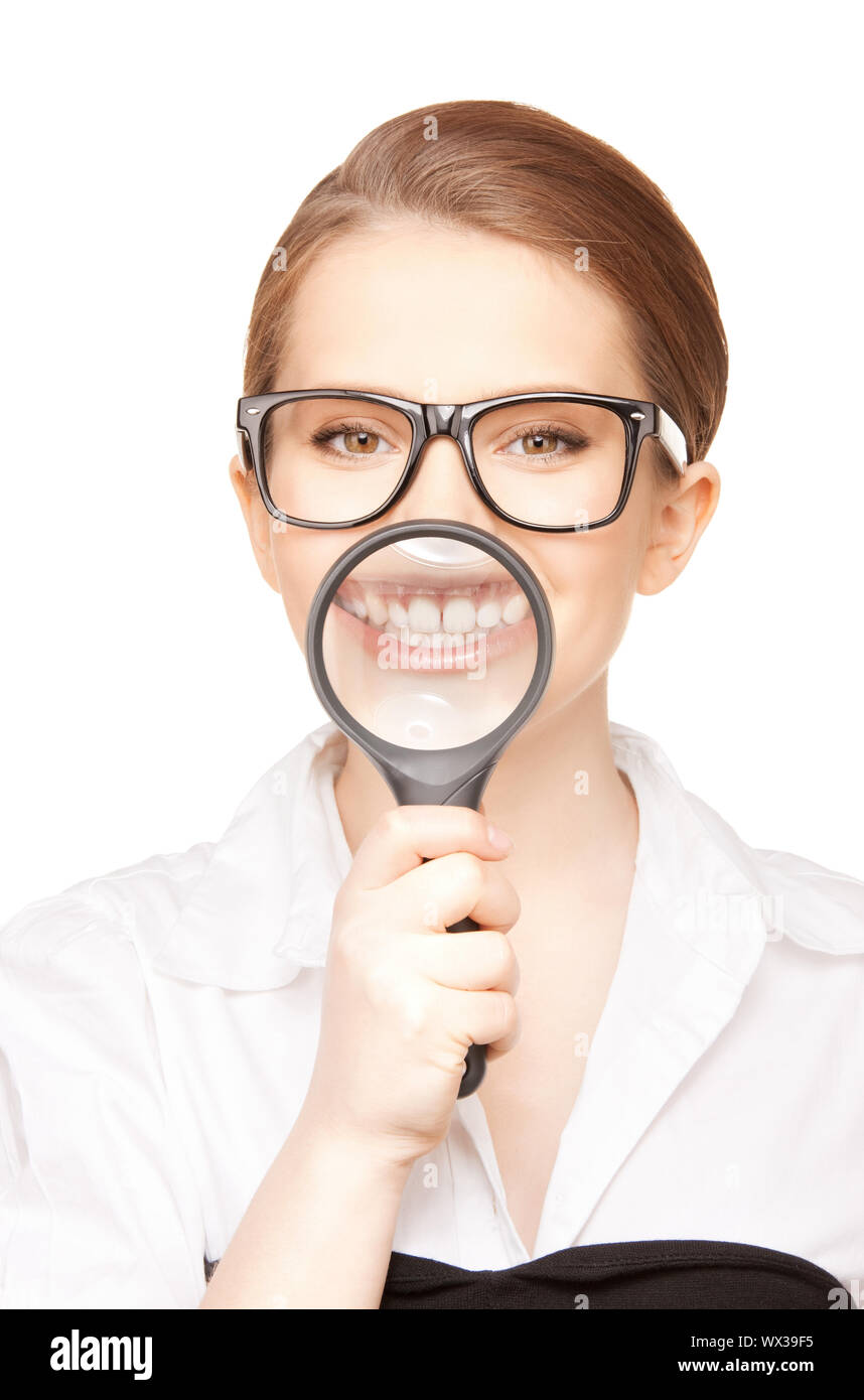 woman with magnifying glass showing teeth Stock Photo - Alamy