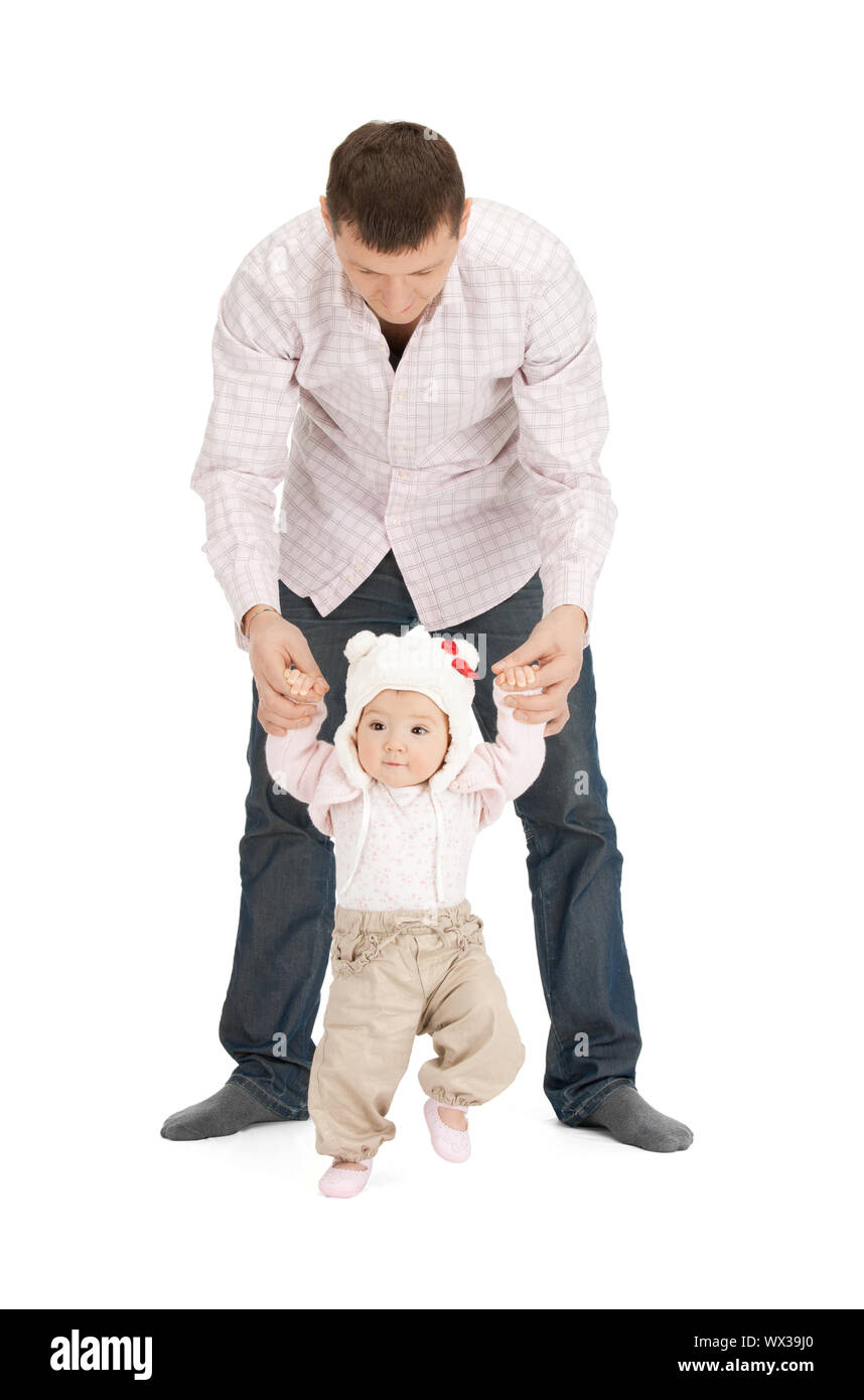 baby making first steps with father help Stock Photo - Alamy