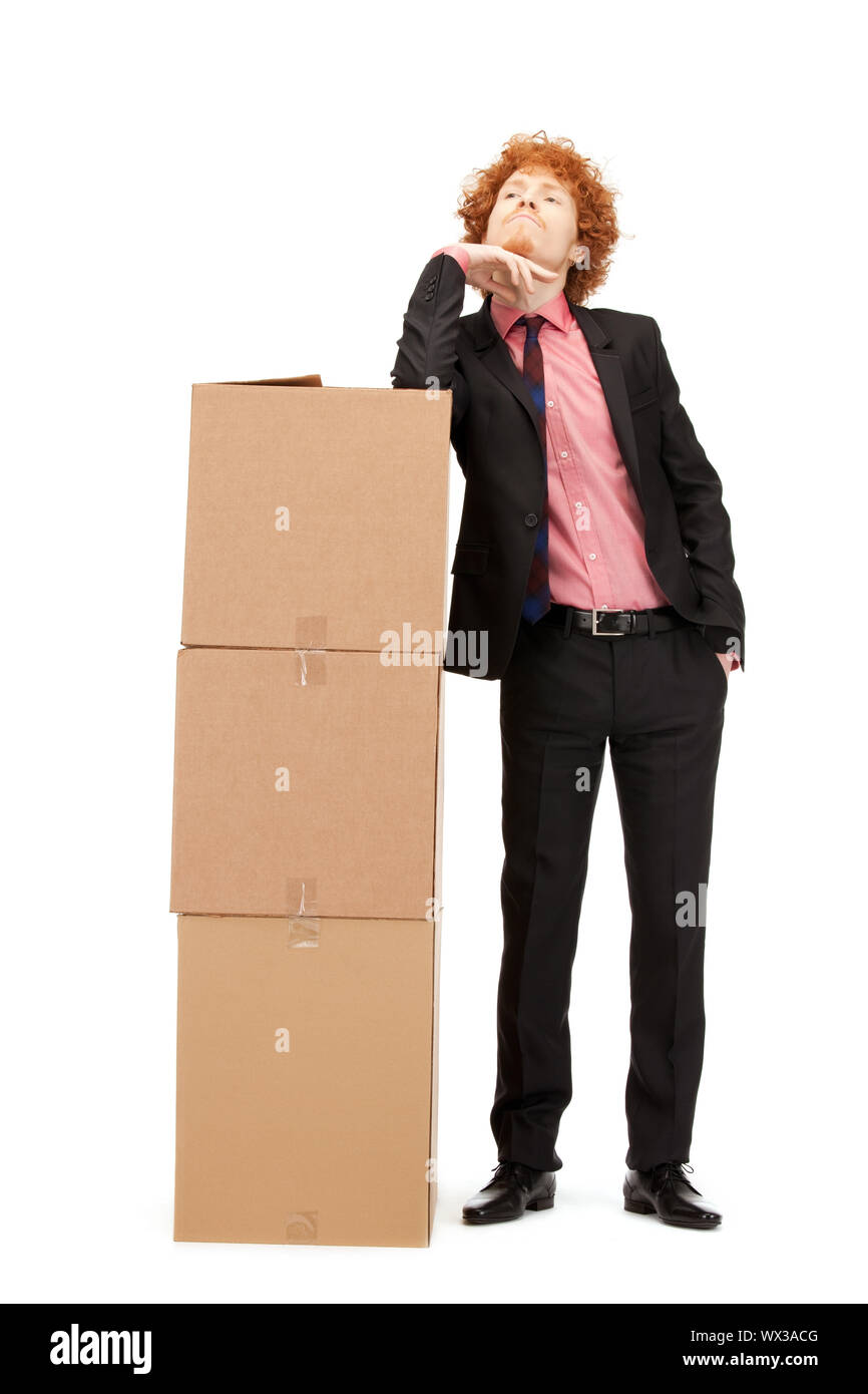 picture of attractive businessman with big boxes Stock Photo - Alamy