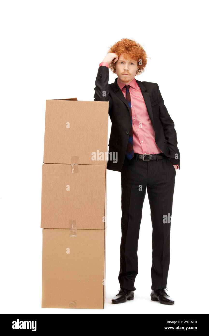 picture of attractive businessman with big boxes Stock Photo - Alamy