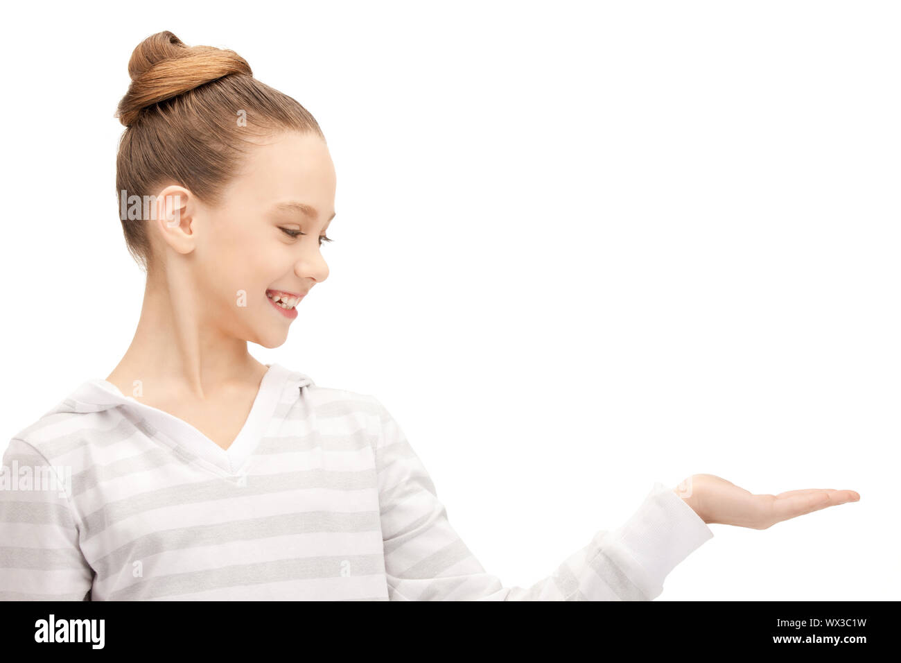 teenage girl showing something on the palm of her hand Stock Photo - Alamy