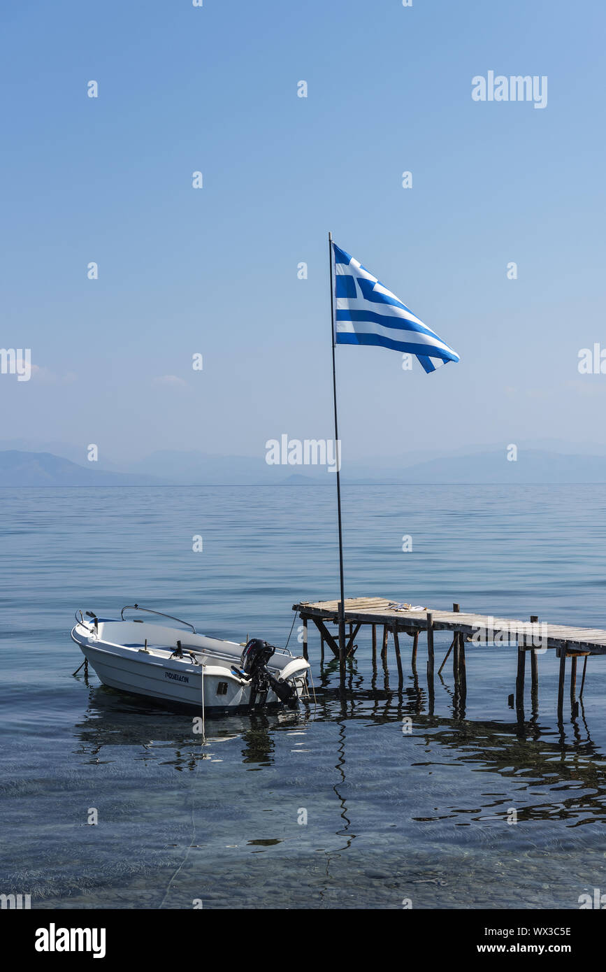 boat, jetty, national flag, Boukari, Corfu, Greece, Europe Stock Photo ...
