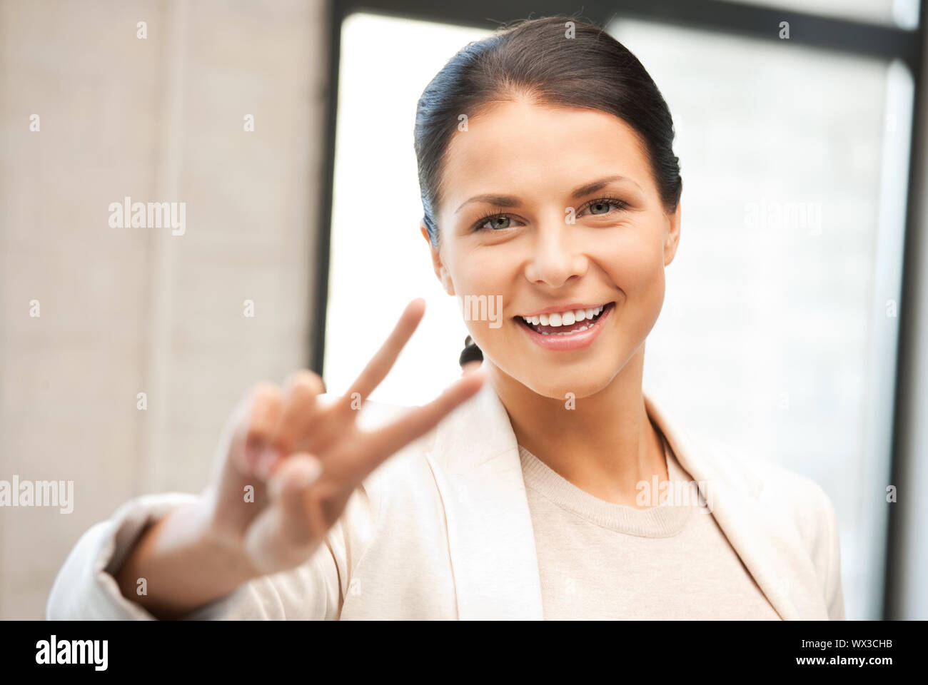 bright picture of lovely teenage girl showing victory sign Stock Photo ...