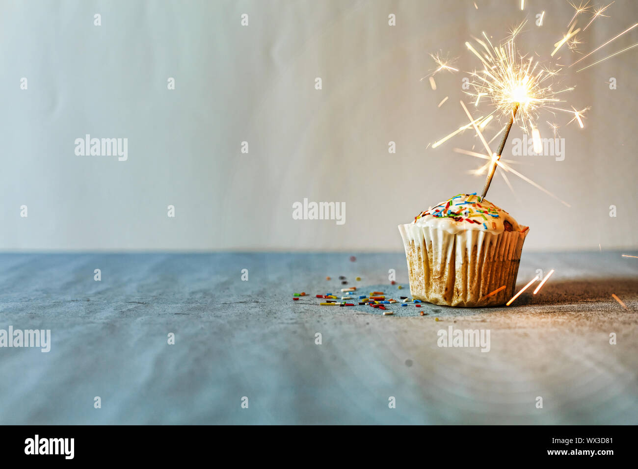 Cupcake, burning sparkler, congratulations, homemade, copy space Stock ...