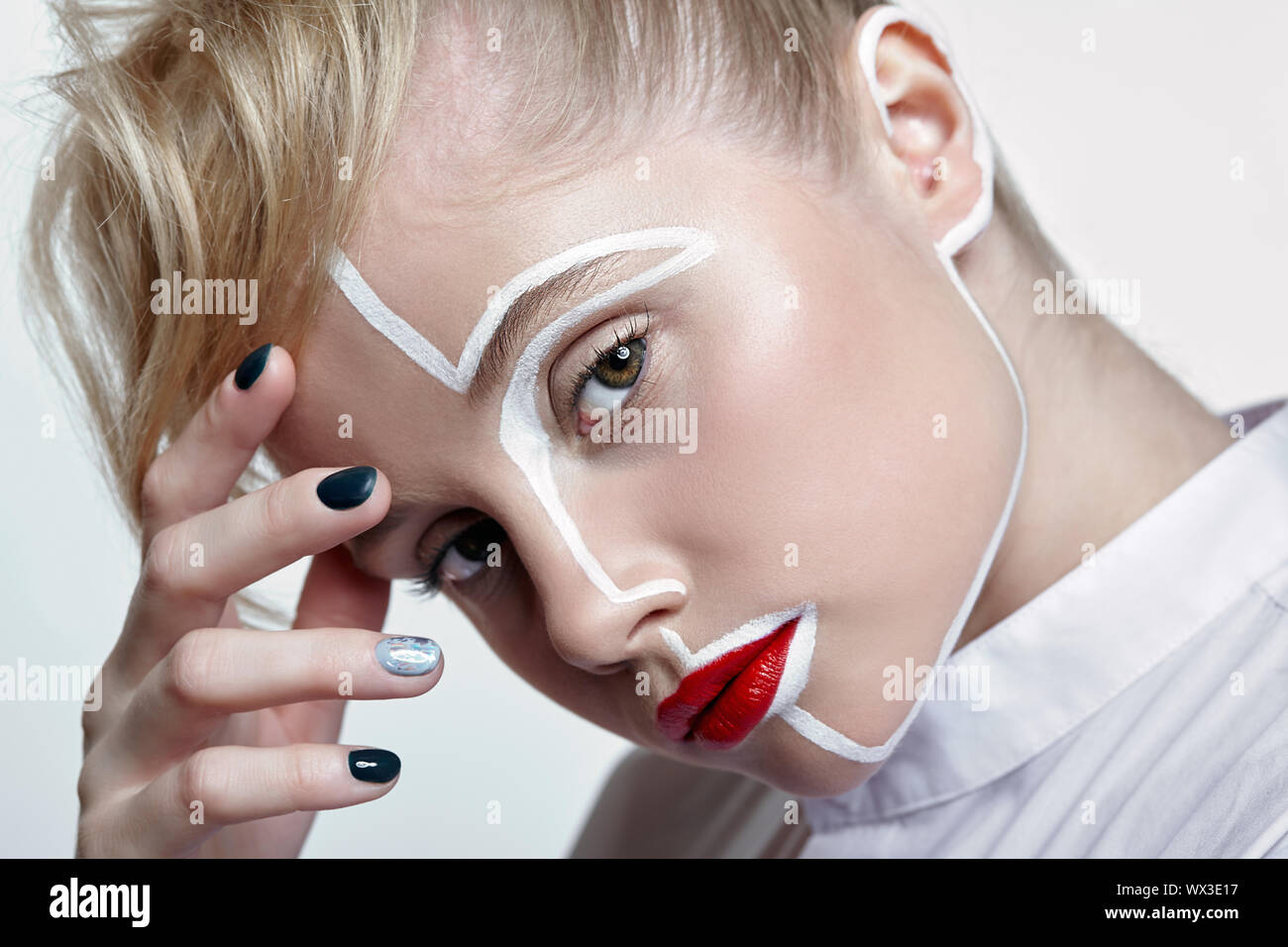 Side view of beautiful young woman. Female with an unusual creative ...
