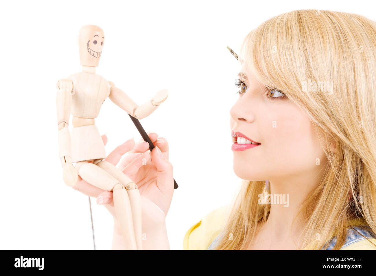 happy teenage girl with wooden model dummy over white Stock Photo - Alamy