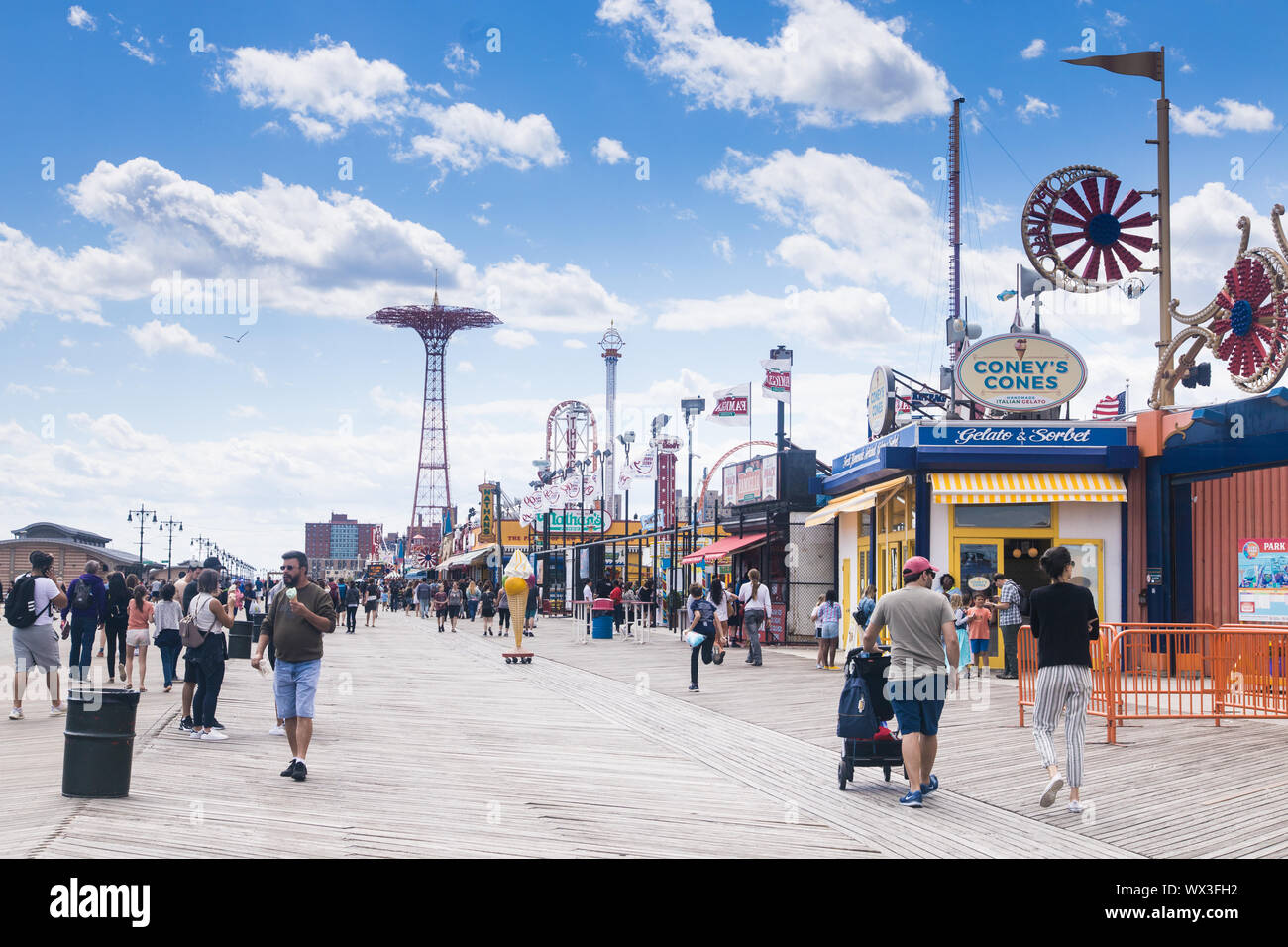 Coney Island, USA - June 14th 2019: Iconic Boardwalk with Parachute ... Coney Island, USA - June 14th 2019: Iconic Boardwalk with Parachute ...